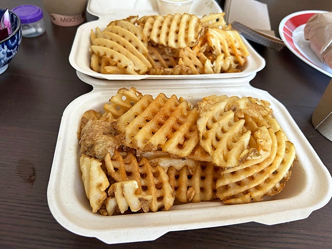 Waffle fries: the perfect sidekick to sandwich superheroes—crispy, golden, and ready to soak up any wayward sauce that dares escape your main attraction.