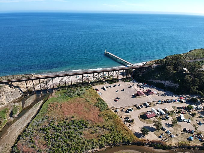 From above, Gaviota reveals its perfect composition – pier stretching into blue infinity while the trestle frames nature's masterpiece below.