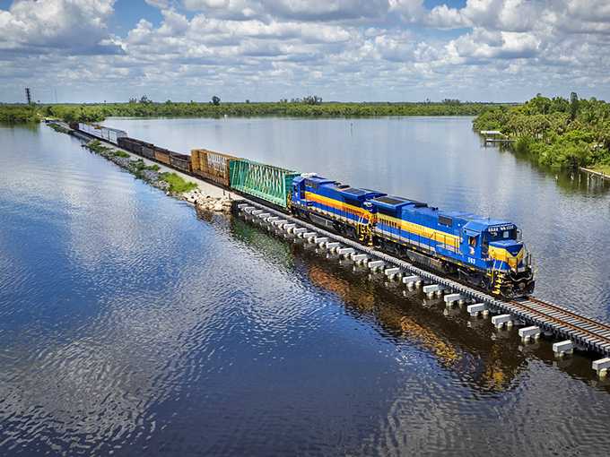 From above, the Seminole Gulf Railway creates a blue ribbon across Florida's waterways—a scene that no roadtrip could ever deliver.