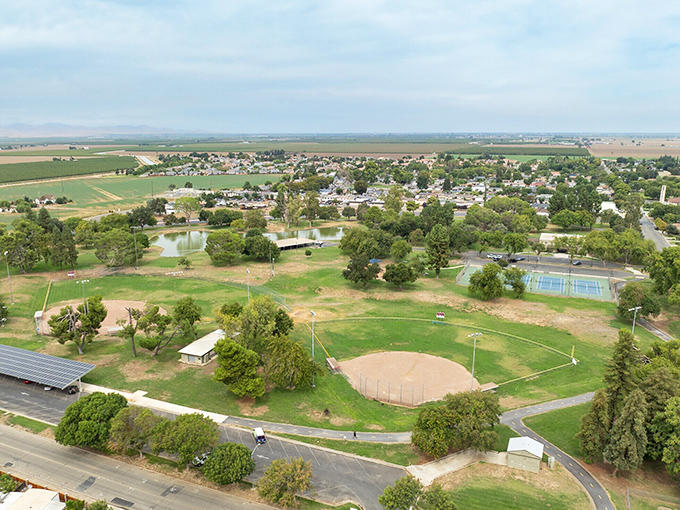 This aerial view reveals Gustine's perfect small-town formula: equal parts park space, baseball diamonds, and enough distance between neighbors to avoid hearing their arguments.