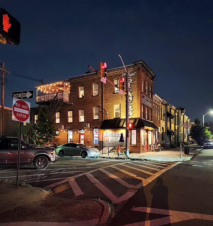 As night falls, L.P. Steamers glows like a lighthouse for the hungry, its corner location illuminated against the Baltimore sky—a beacon of deliciousness.
