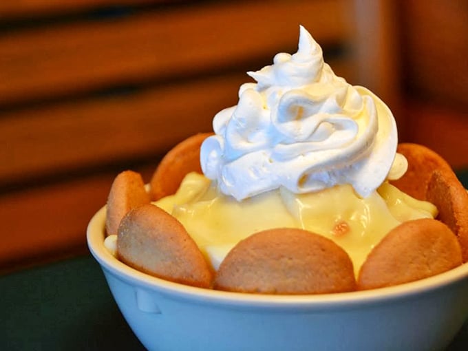 Banana pudding crowned with vanilla wafers and whipped cream—the dessert equivalent of a standing ovation at the end of a perfect meal.