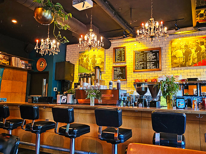 The bar area gleams with possibility under vintage chandeliers—where coffee transforms into cocktails as the day unfolds.