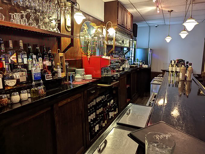 A bar stocked for serious enjoyment. This isn't some trendy mixology lab—it's where classic cocktails and Italian wines find their perfect audience.