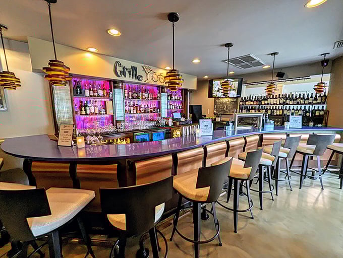 The bar at Grille 3501 isn't just where drinks are served—it's command central for an evening of culinary bliss. Those stools have stories.