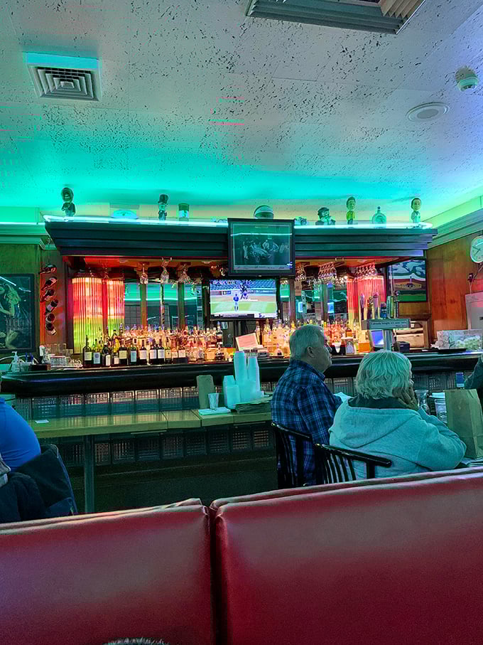 The bar area glows with an otherworldly green light, as if to say, "Yes, martinis and meatballs can coexist in perfect harmony."