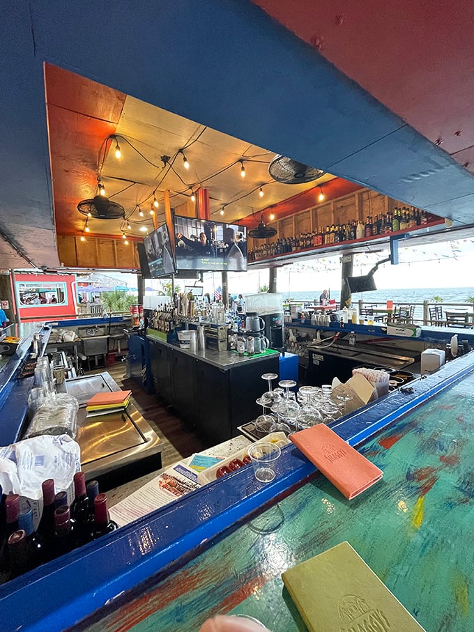 A bar that understands priorities: cold drinks, good views, and the promise of seafood just moments away from your glass.
