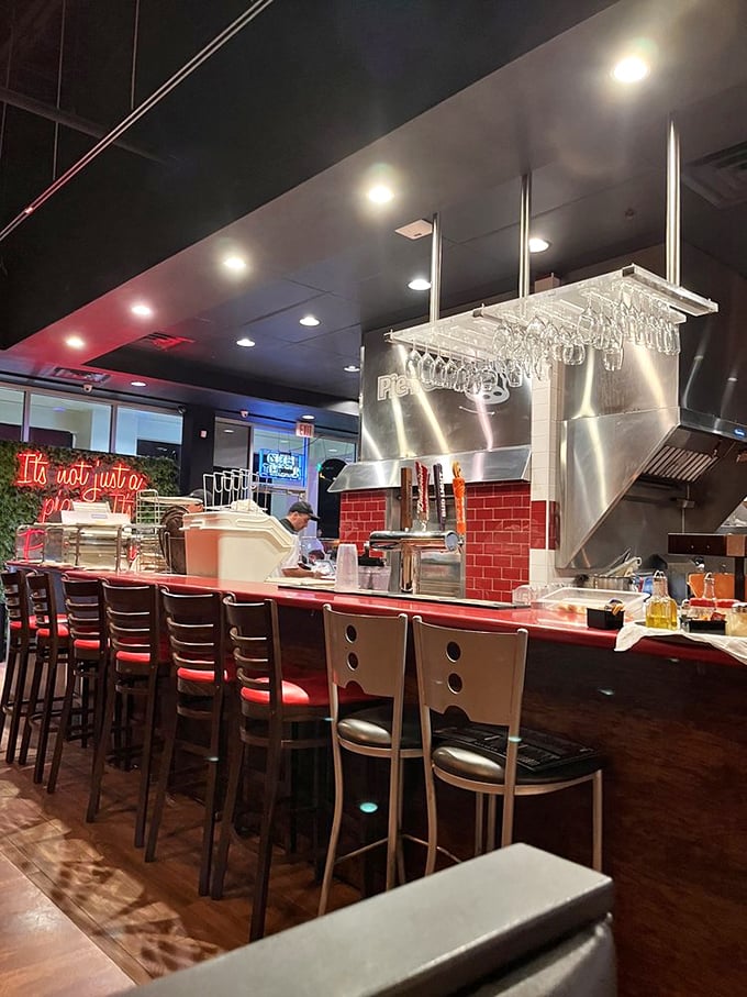 The open kitchen isn't just for show—it's theater where dough-tossing and flame-kissing create the perfect prelude to your meal.