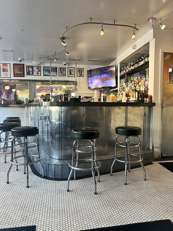 The bar area proves this isn't your grandmother's diner – unless your grandmother was surprisingly progressive about combining milkshakes with cocktails.