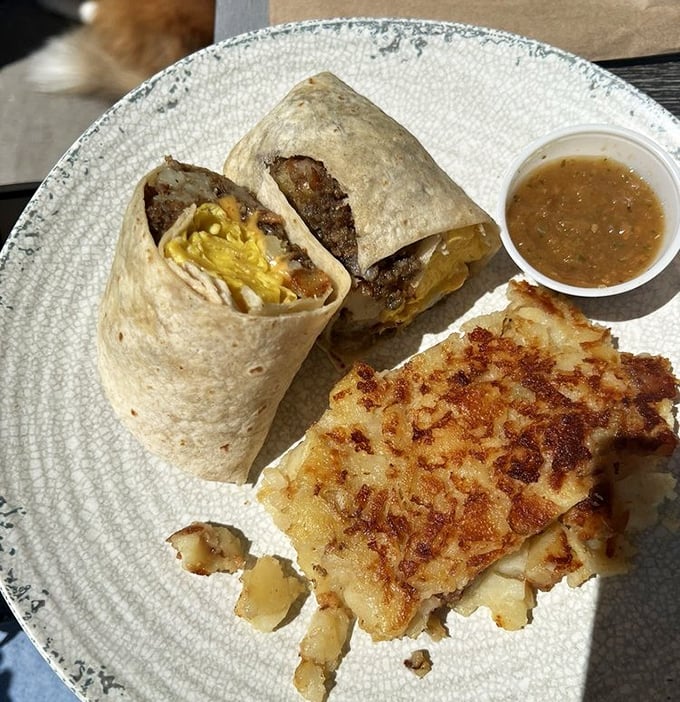 Breakfast goes portable with this hearty burrito alongside crispy hash browns – the morning meal that keeps Nashville fueled all day.