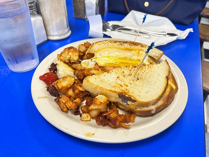 The breakfast sandwich—humanity's greatest invention since sliced bread, which, conveniently, is also involved in this masterpiece of morning engineering.