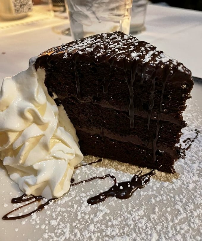 Chocolate cake so decadent it should require a permission slip – the perfect finale to a meal worth crossing state lines for.