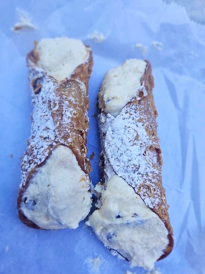 The cannolis that launched a thousand return visits—crisp shells, creamy filling, and a dusting of powdered sugar that makes these worth every delicious calorie.