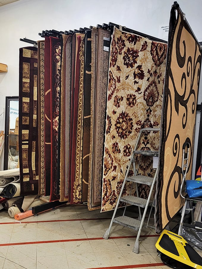 The carpet display – where floor coverings hang like artwork, waiting to transform your room from "meh" to "magnificent" on a budget.