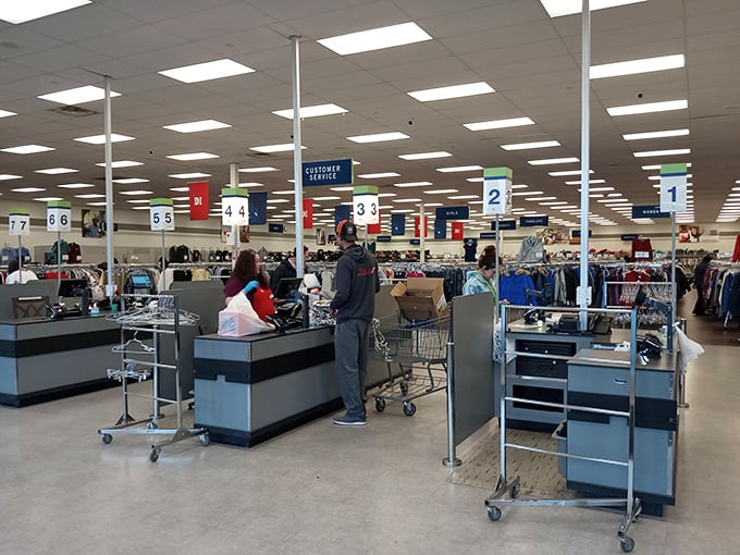 Where retail therapy meets efficiency—numbered checkout lanes keep the treasure flow moving as shoppers exit with their newfound bounty.