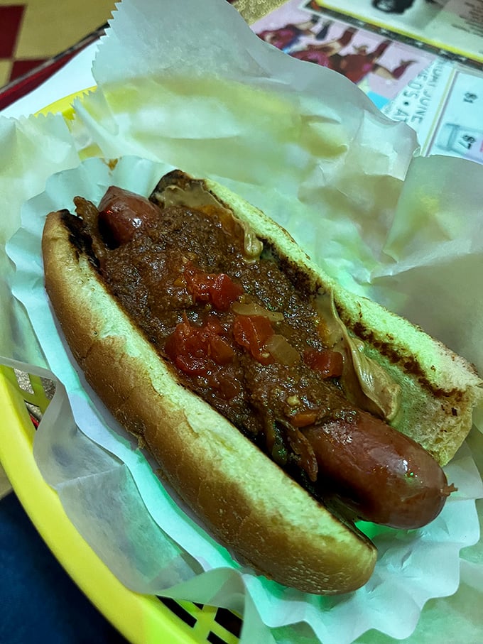 A proper chili dog should require both napkins and commitment. This beauty delivers with a blanket of savory chili that means business.