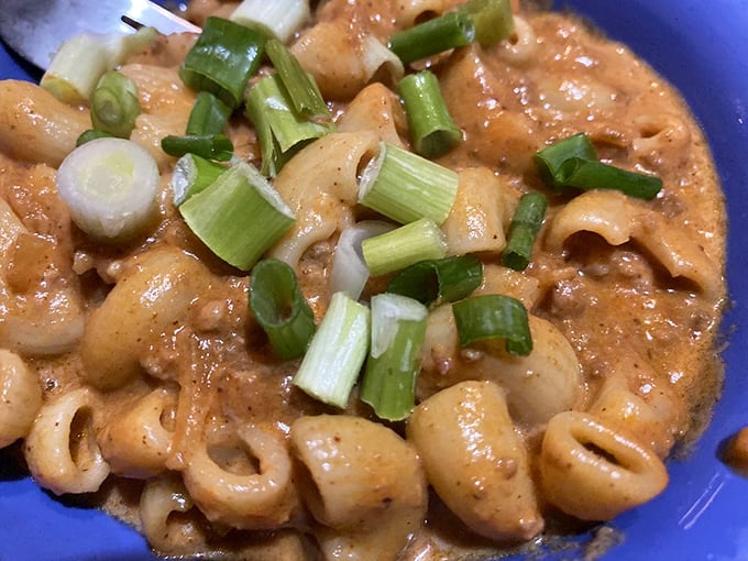Mac and cheese with a kick that makes you wonder why you ever ate it plain. Those green onions aren't garnish—they're confetti for your victory party.