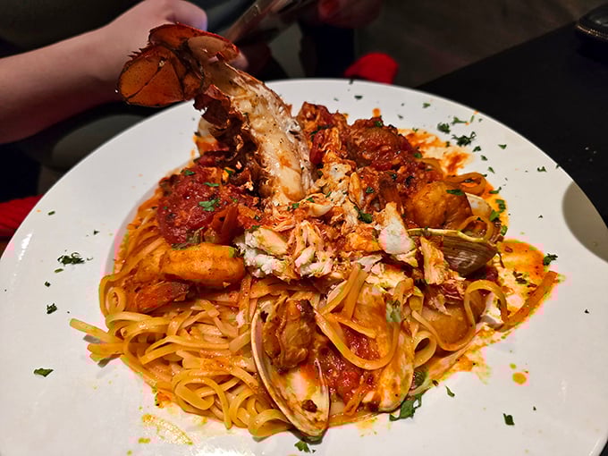This seafood pasta isn't just dinner—it's an underwater expedition where lobster, clams, and shrimp have gathered for a tomato-sauced summit meeting on your plate.