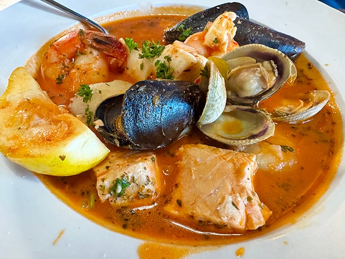 This cioppino isn't just soup—it's a seafood United Nations where each maritime delegate contributes to a brothy summit of flavor.