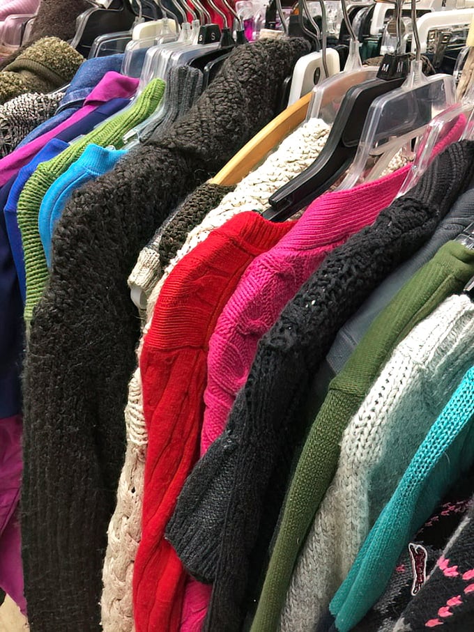 A technicolor dream rack of sweaters that proves knitwear is the comfort food of fashion—warm, familiar, and impossible to have just one.