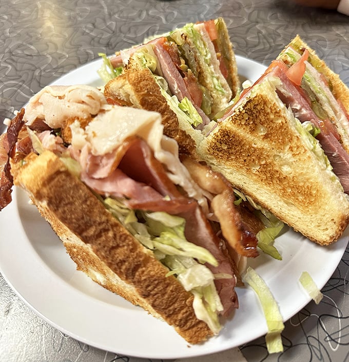 The club sandwich – architectural marvel of the diner world, where layers of meat, cheese and veggies create the skyscraper of lunch options.