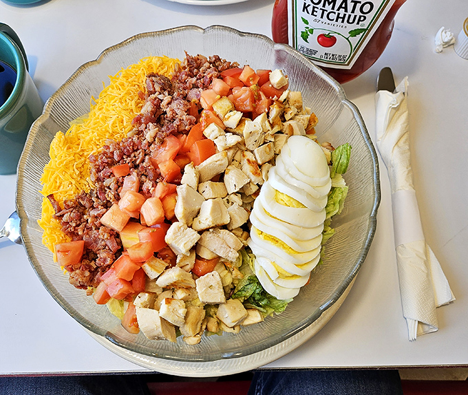 This Cobb salad isn't just arranged—it's composed like a delicious color wheel of protein and vegetables that somehow feels both virtuous and indulgent.