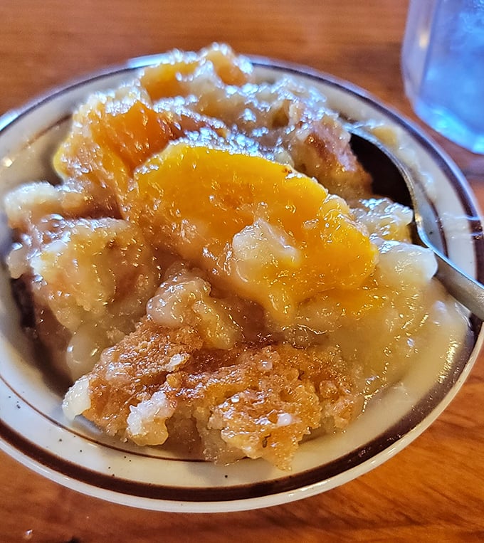 Peach cobbler that captures summer in a bowl – warm, sweet, and just like grandma's, if grandma had a secret deal with the peach gods. Photo