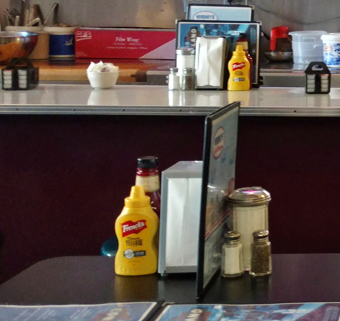 Every great diner meal starts with these humble table essentials—napkins, mustard, salt, and pepper standing at attention.