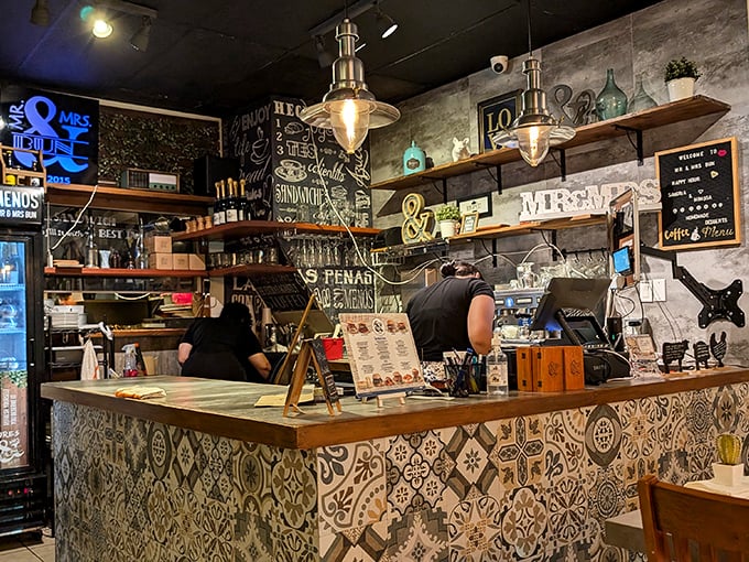 Where the magic happens—a counter adorned with colorful tiles and purpose. Behind it, culinary wizards transform simple ingredients into memorable meals.
