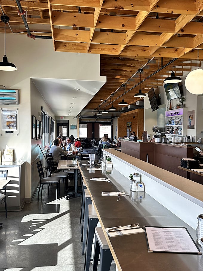 Morning light streams through windows onto wooden tables where coffee cups steam and breakfast dreams come true. This is where Santa Fe starts its day.