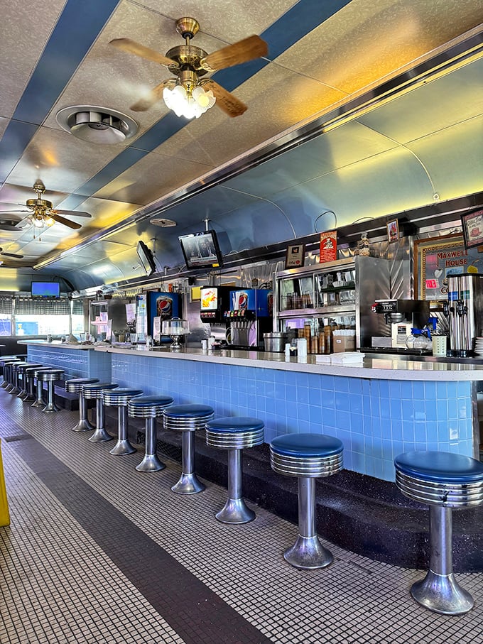 The counter isn't just seating—it's front-row tickets to the greatest show on earth: short-order cooks working their magic.