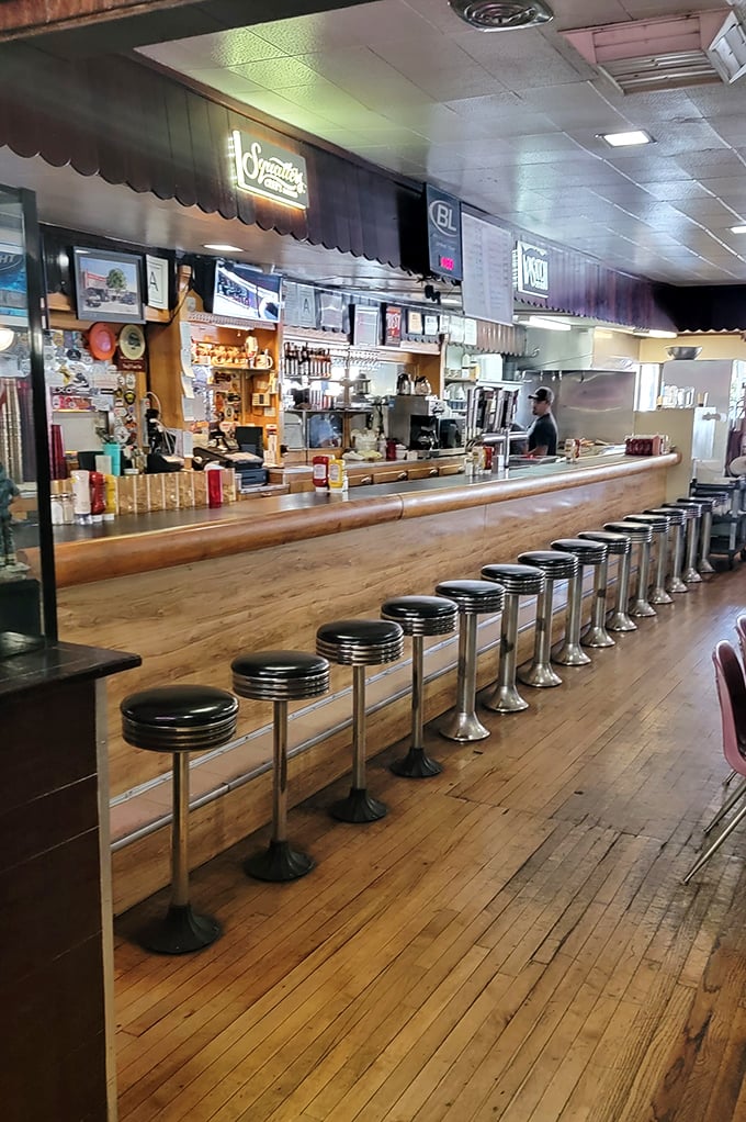 The counter at Ray's isn't just seating – it's front-row tickets to culinary theater where burgers are the headlining act.