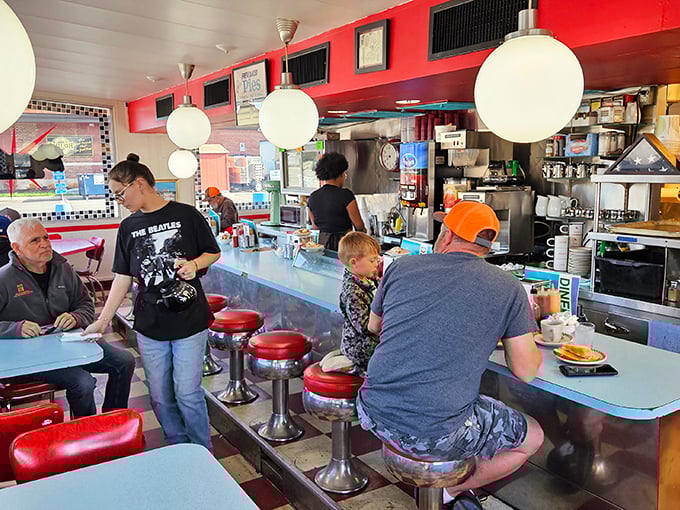 The counter—where solo diners become temporary family and the coffee keeps flowing like conversation. The heart of any true diner.