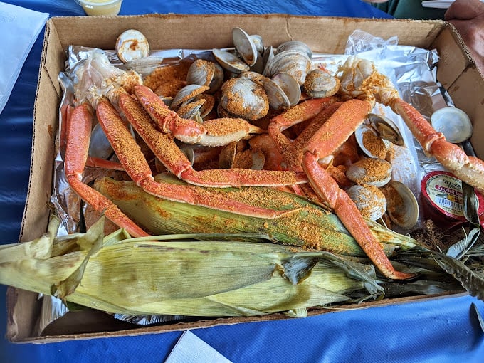 The seafood box that makes grown adults giddy – where corn, clams, and crab legs coexist in Old Bay-dusted harmony.