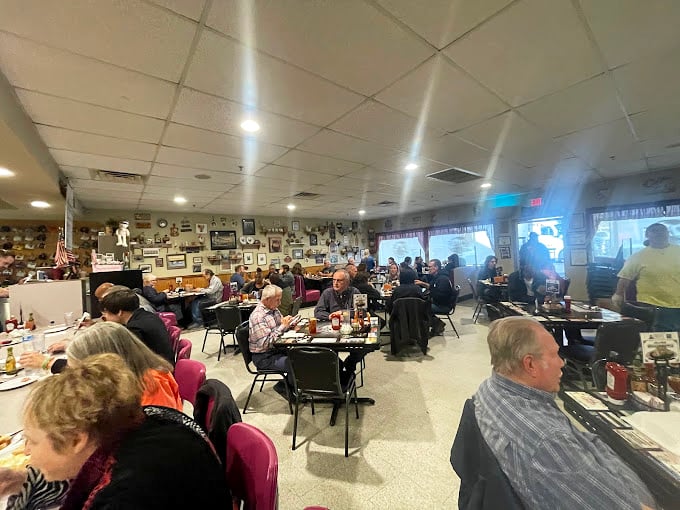 The bustling dining room on a typical morning – where strangers become temporary tablemates united by the universal language of "pass the syrup, please."