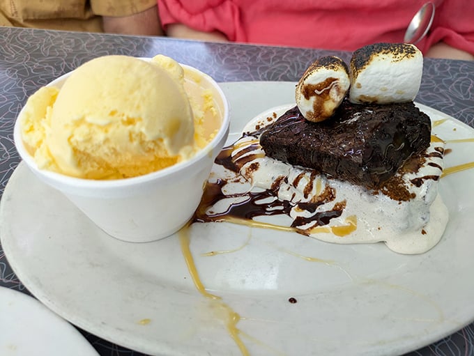 Dessert that understands the importance of excess – brownie, ice cream, toasted marshmallows, and chocolate sauce in perfect harmony. Diet starts tomorrow.
