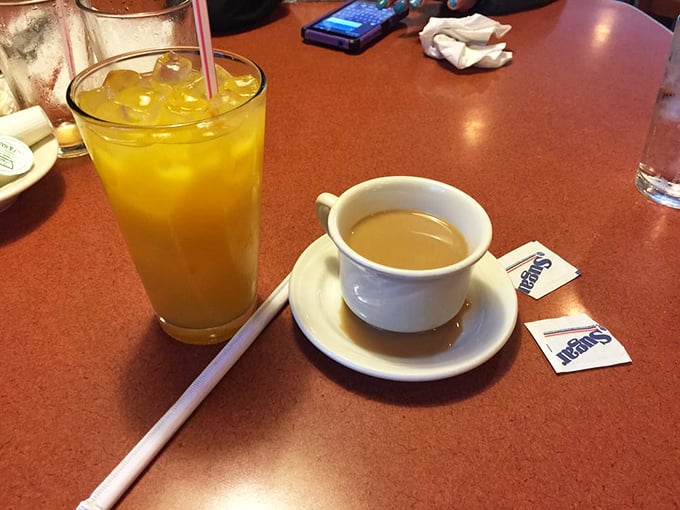 The breakfast power couple – fresh orange juice bringing the sunshine while coffee delivers that necessary jolt of morning motivation.