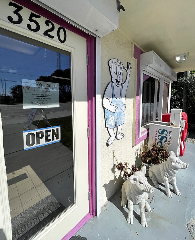 Even the entrance makes a statement with cartoon pigs and white pig planters – a playful preview of the porcine theme awaiting inside.