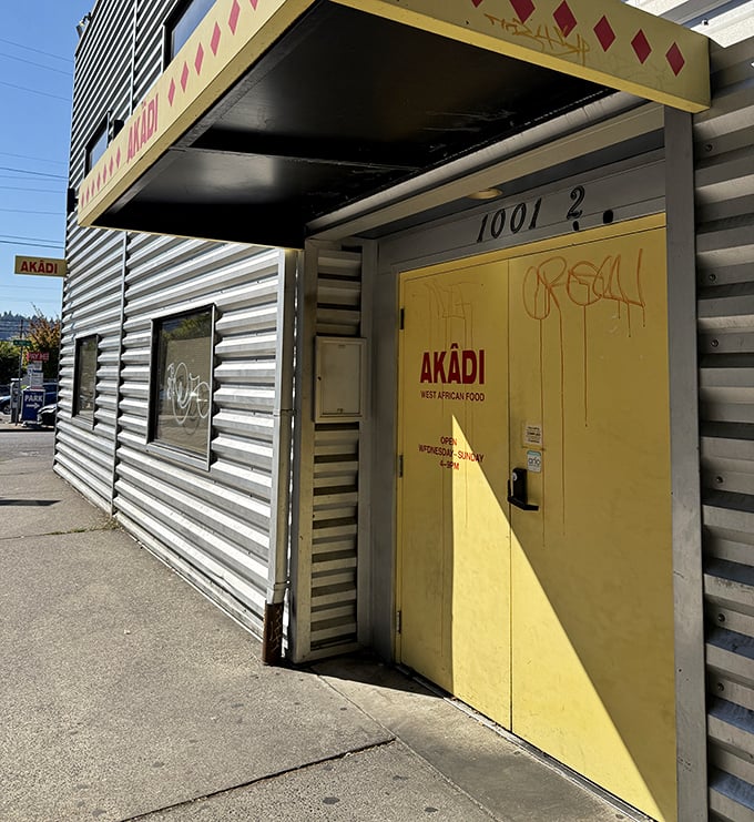 The sunshine-yellow entrance door is Portland's portal to West Africa – no passport required, just an appetite for adventure.