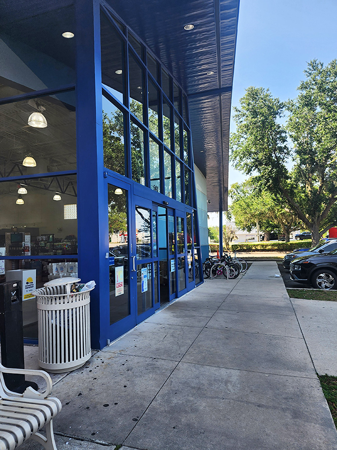 The welcoming facade offers a glimpse of the treasure cave within—Florida sunshine reflecting off those signature blue accents.