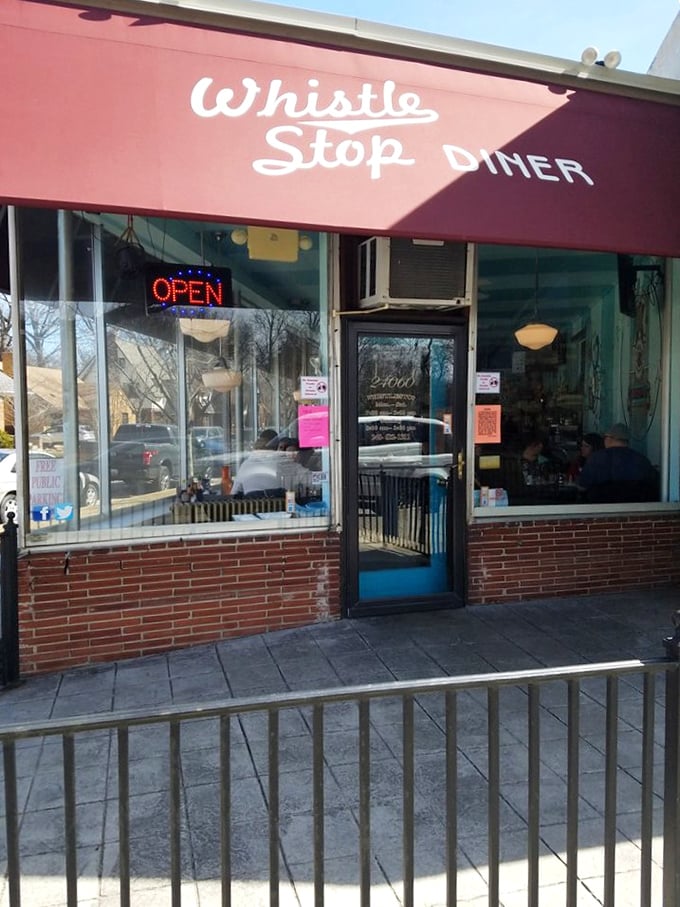 That red awning and blue door combo isn't just charming—it's the breakfast equivalent of Superman's outfit, signaling that ordinary hunger doesn't stand a chance here.