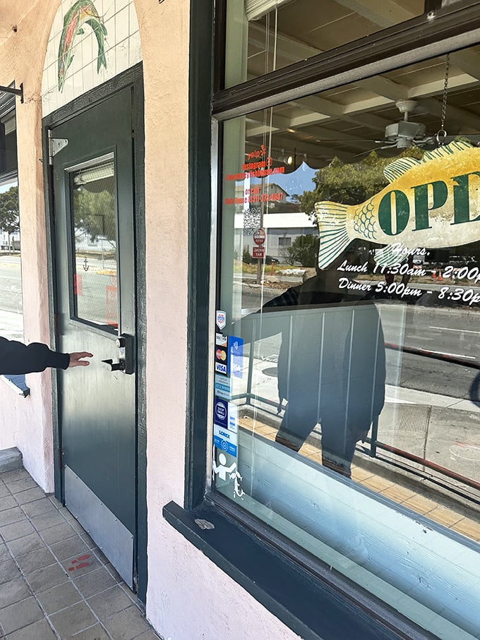 The entrance—where that simple fish tile above the door might as well be a secret handshake for those in-the-know about Monterey's best-kept seafood secret.