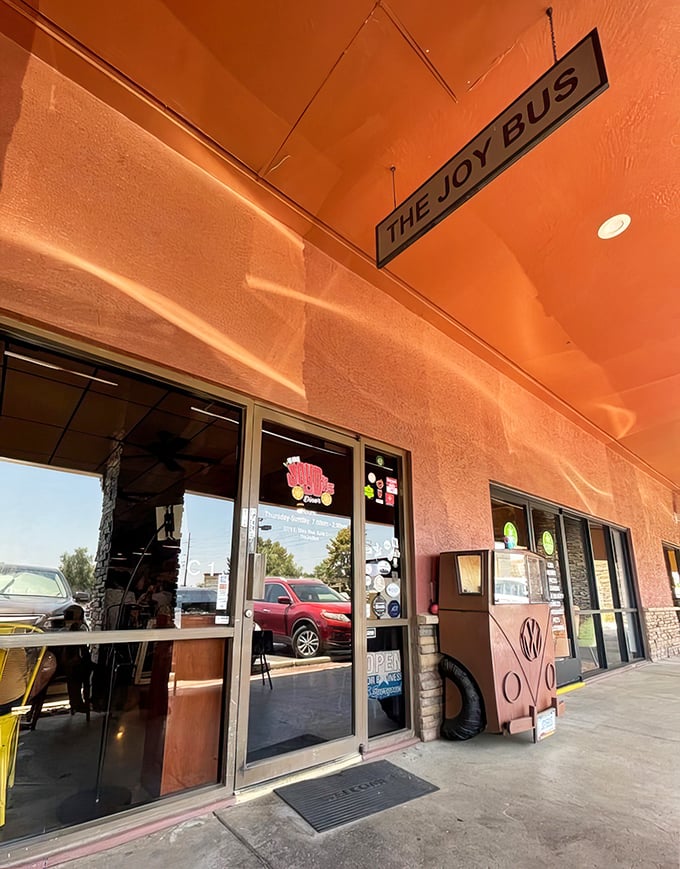 The entrance promises adventure with its simple sign and warm colors—like the opening credits to your new favorite food show.
