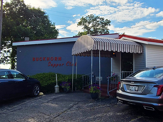 The blue exterior with striped awning stands like a beacon for hungry travelers. This isn't just a restaurant—it's a destination.