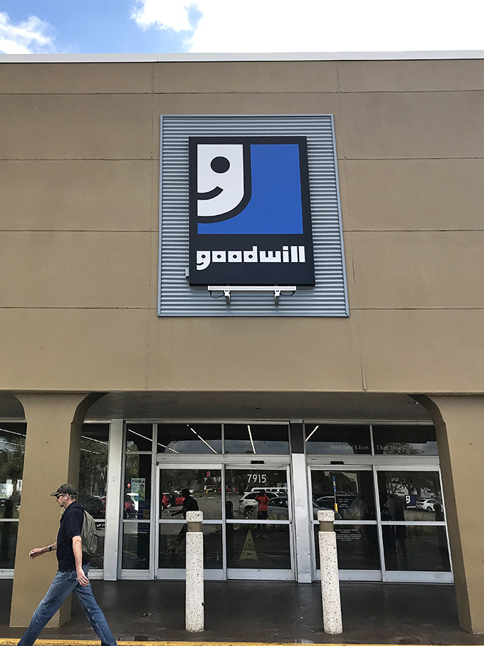 The smiling Goodwill logo welcomes all treasure seekers. Like the entrance to a theme park, but the rides are shopping carts.