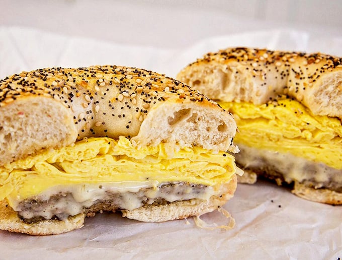 The everything bagel breakfast sandwich – where fluffy eggs and melted cheese find their perfect home between seeds and spices.