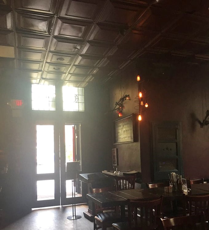 Moody lighting and historic details create the perfect atmosphere for plotting your next meal or planning a revolution – your choice.