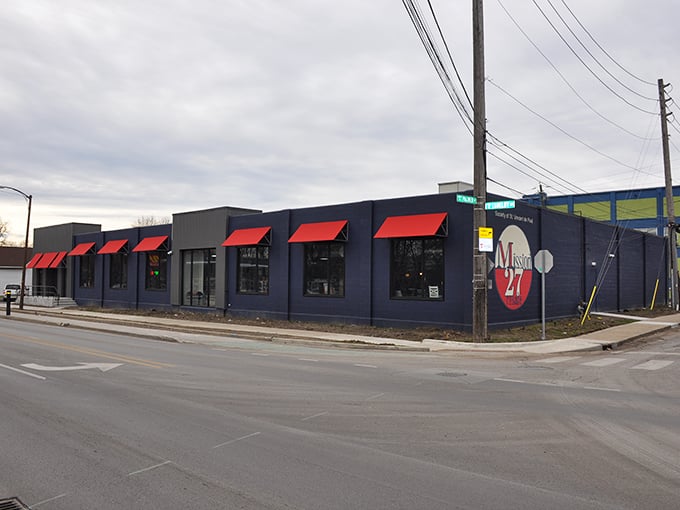 The navy exterior with striking red awnings stands as a beacon of bargains at the corner of Shelby Street—Mission 27's promise of treasures visible from blocks away.