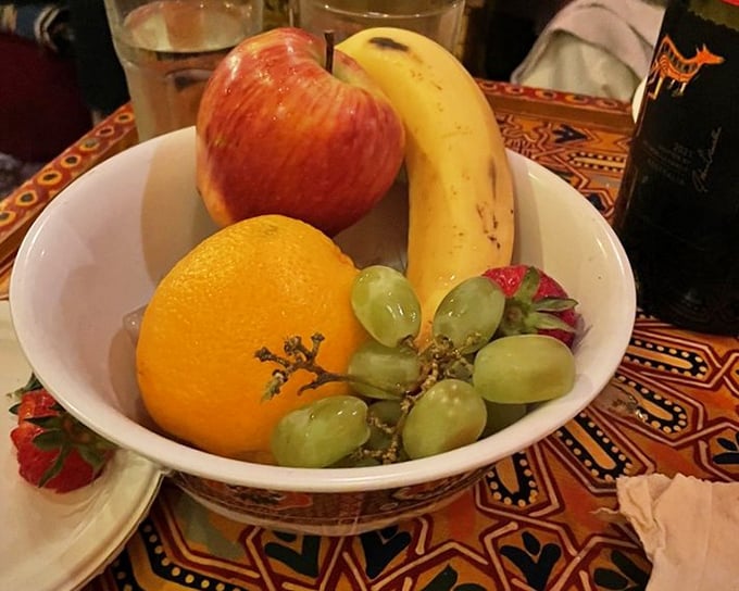 The meal's finale arrives with simple, fresh fruit—nature's palate cleanser after a flavor journey that's taken your taste buds across the Mediterranean and back.