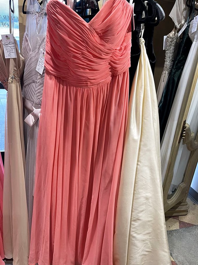 Formal gowns hanging like patient debutantes—ready to transform an ordinary evening into something from a fairy tale, without the fairy tale price.